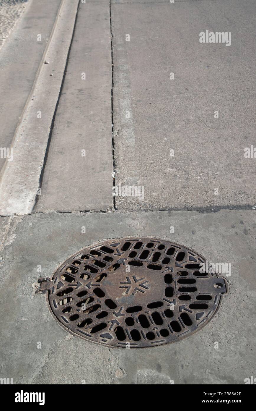 Manhole cover has rust on the street Stock Photo - Alamy