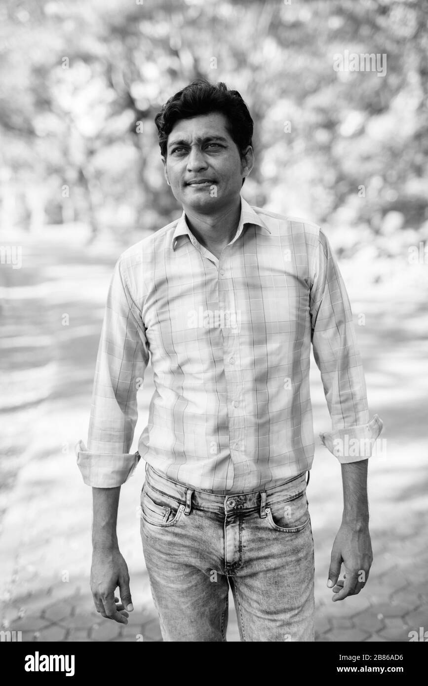 Indian man standing Black and White Stock Photos & Images - Alamy