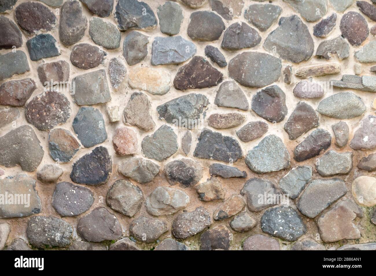 A close up view of a stone and concrete wall Stock Photo - Alamy