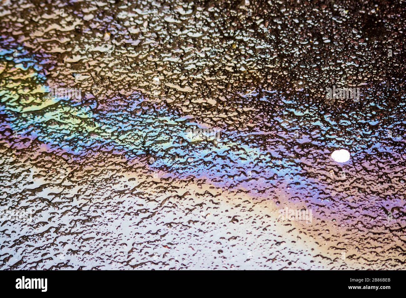 Colorful oil slick on pavement hi-res stock photography and images - Alamy