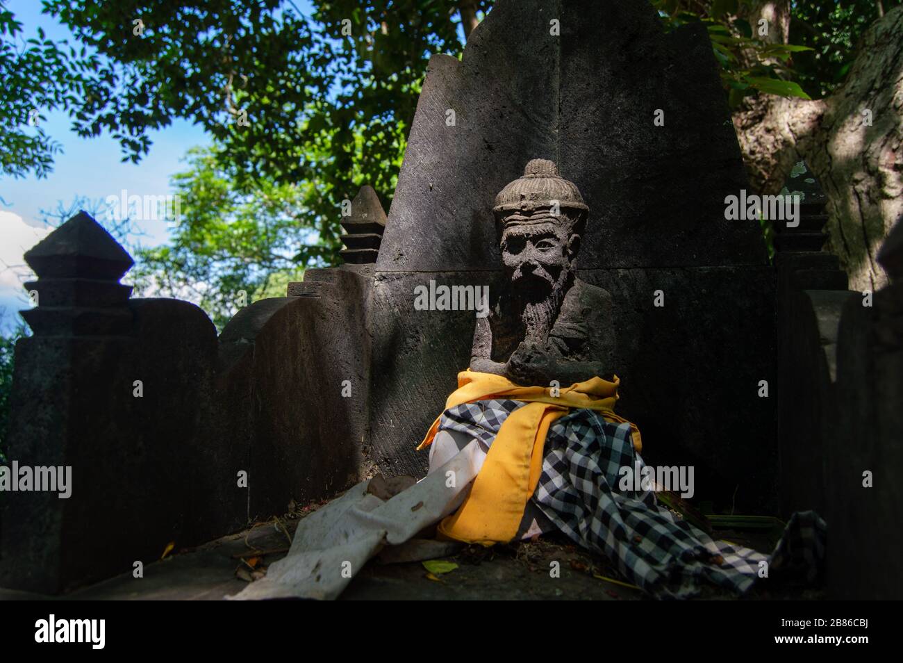 Stone religious statue in the mountain in Bali close to the Pura ...