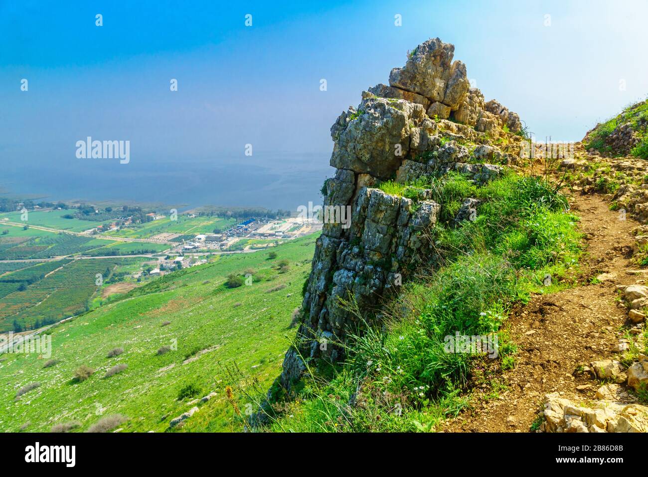 View of hiking trail, rocks and the Sea of Galilee, Mount Arbel ...