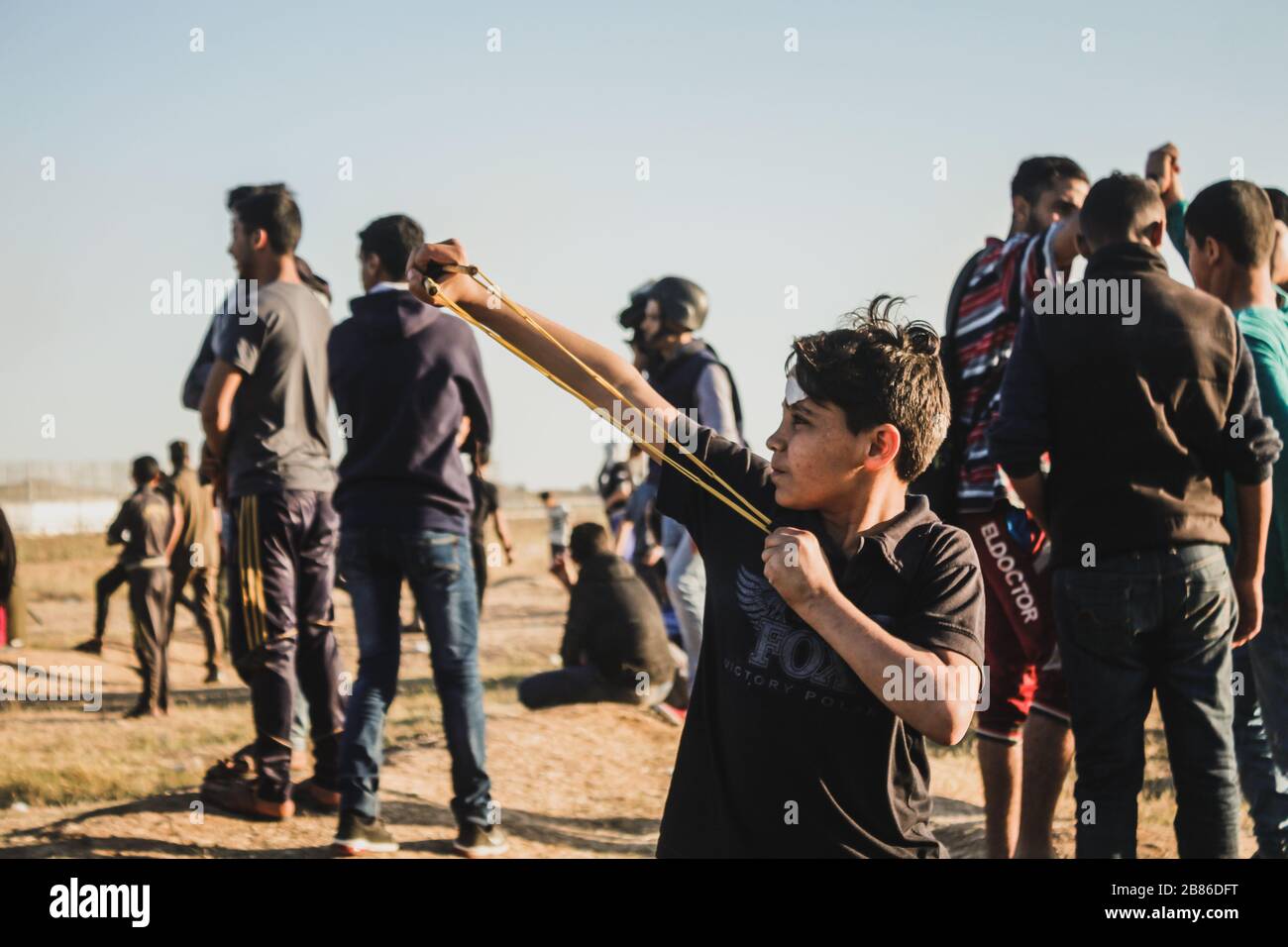 Small kid use Slingshot, against Israeil- in Gaza protests march of ...