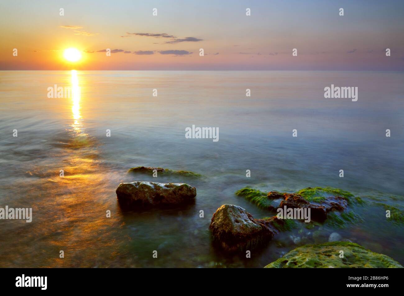 Beautiful golden sunset over Black sea rocky coastline in Crimea on ...