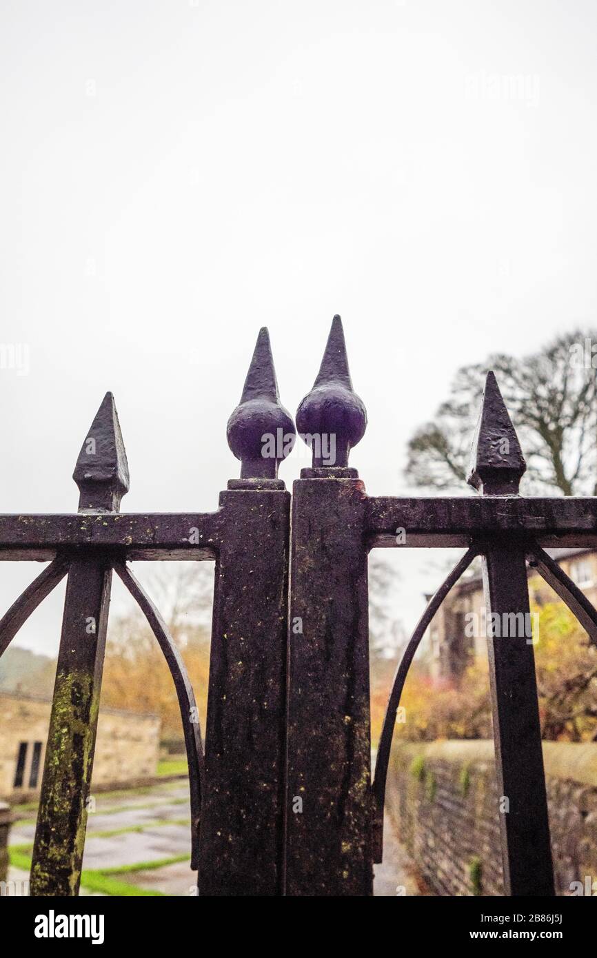 Spikes on a two black wrought iron gates Stock Photo - Alamy