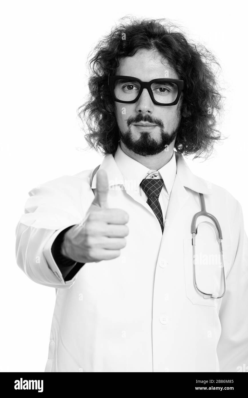 Studio shot of handsome man doctor giving thumb up Stock Photo - Alamy