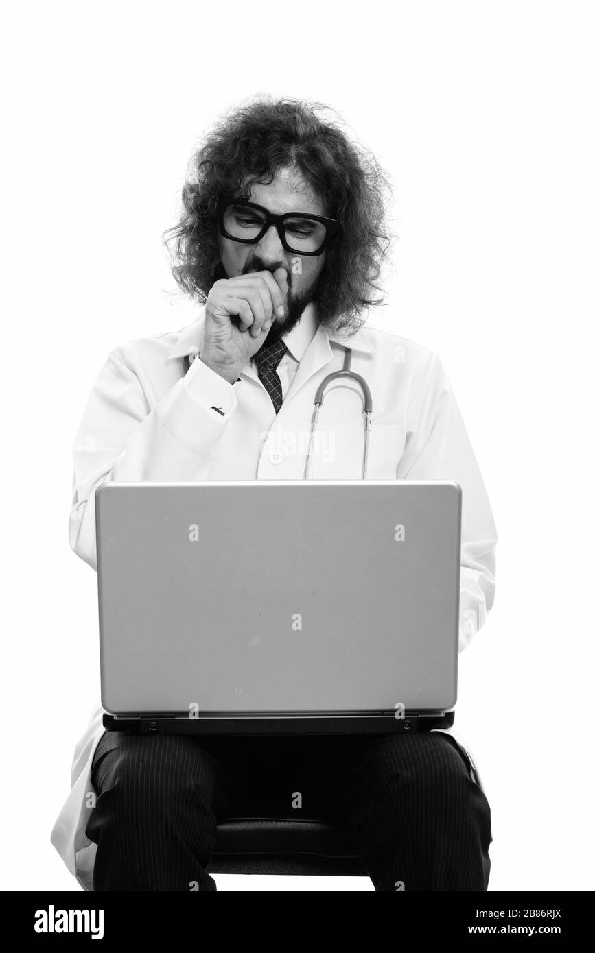 Tired doctor using laptop hi-res stock photography and images - Alamy