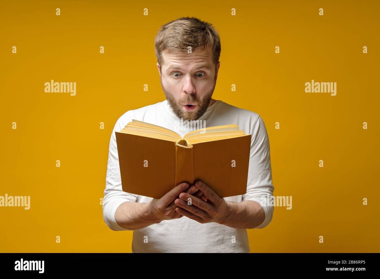 Man reading book shocked expression hi-res stock photography and images ...