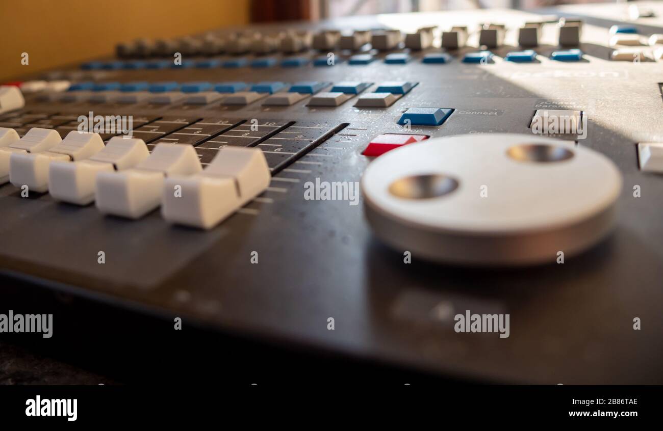Sound mixer control panel with sliders and buttons closeup view ...
