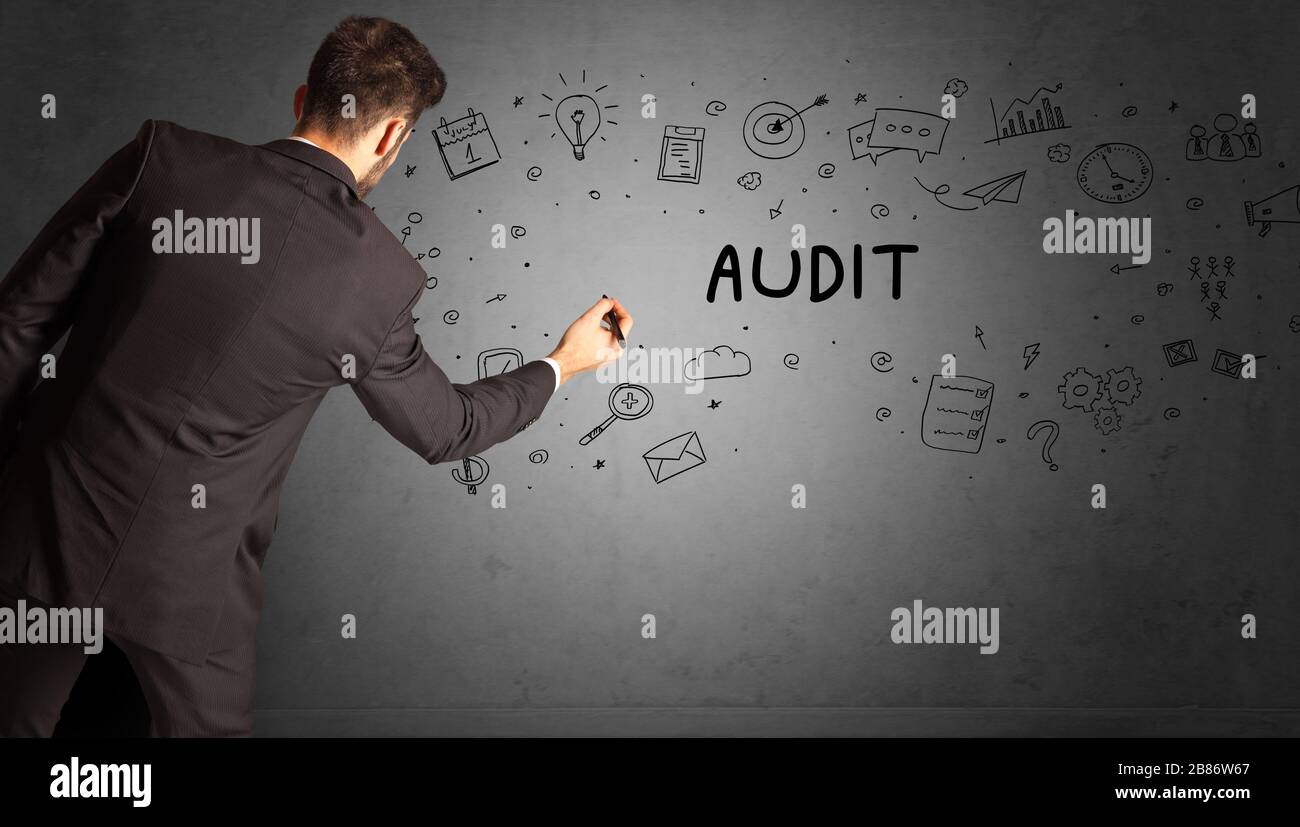 businessman drawing a creative idea sketch with AUDIT inscription ...
