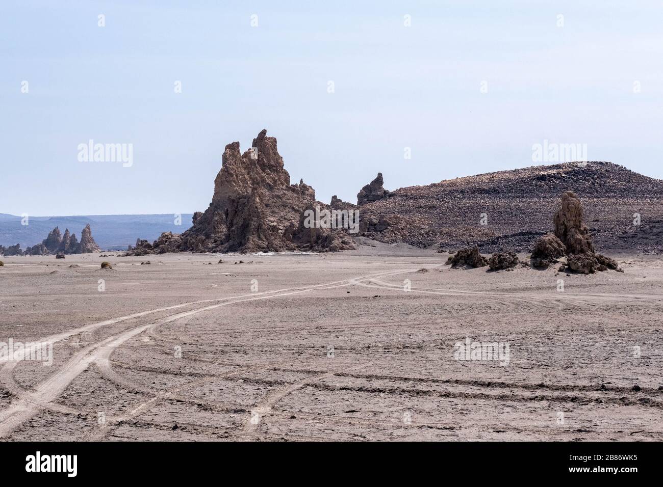 Africa, Djibouti, Lake Abbe. Landscape view of lake Abbe Car tracks are ...