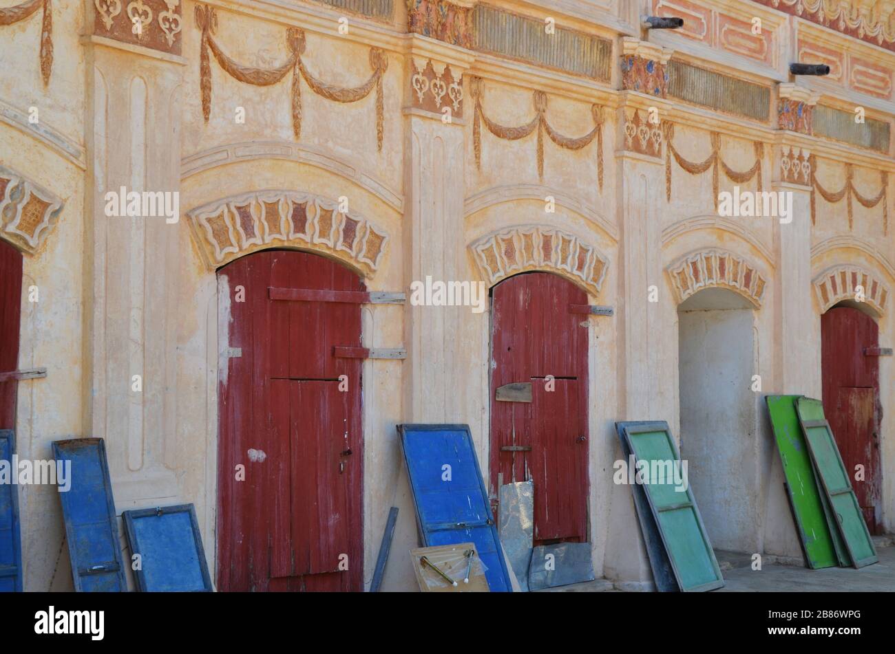 Colorful wooden doors on the white facade of ananda pahto temple Bagan ...