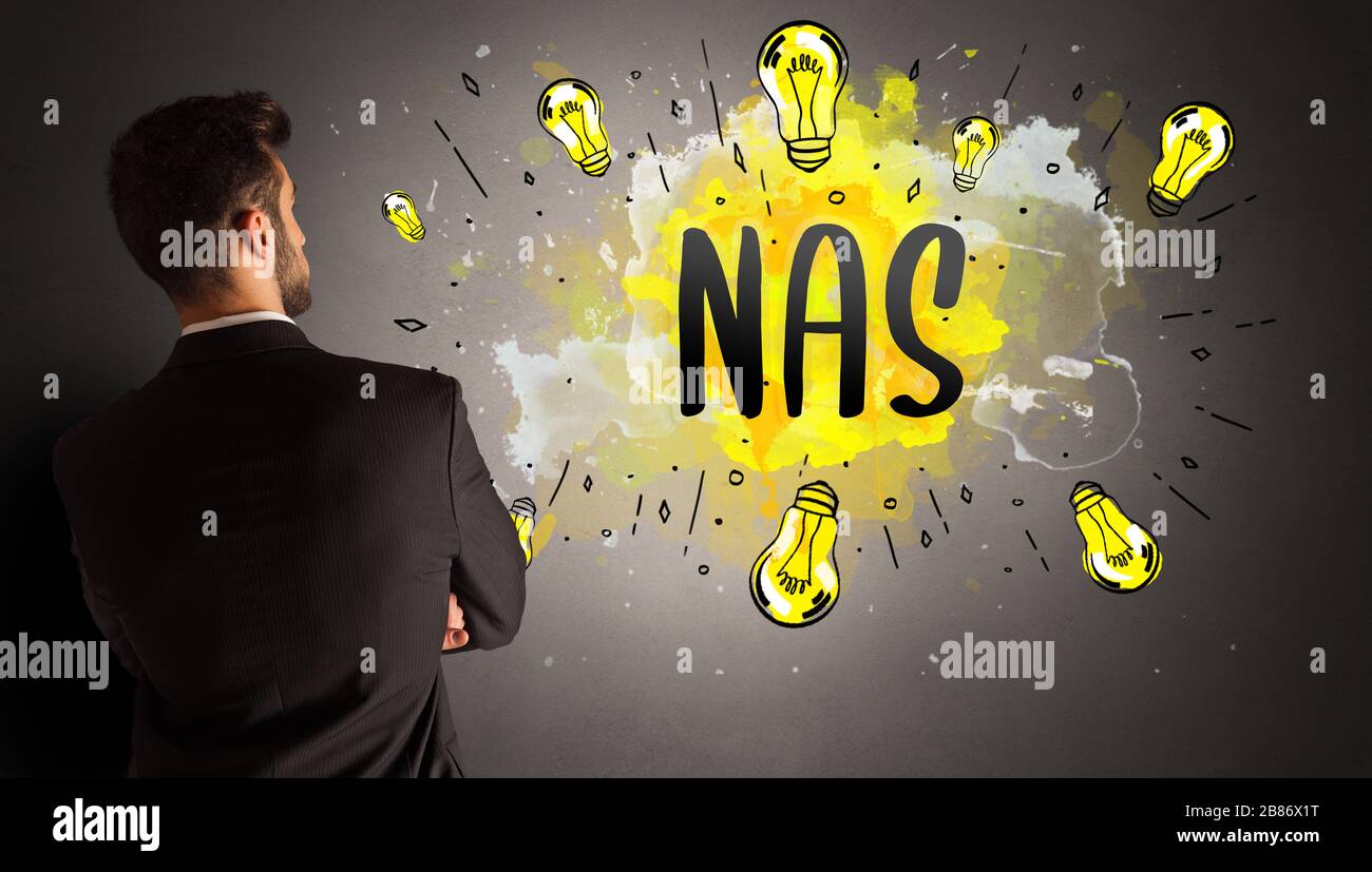 businessman drawing colorful light bulb with NAS abbreviation, new ...