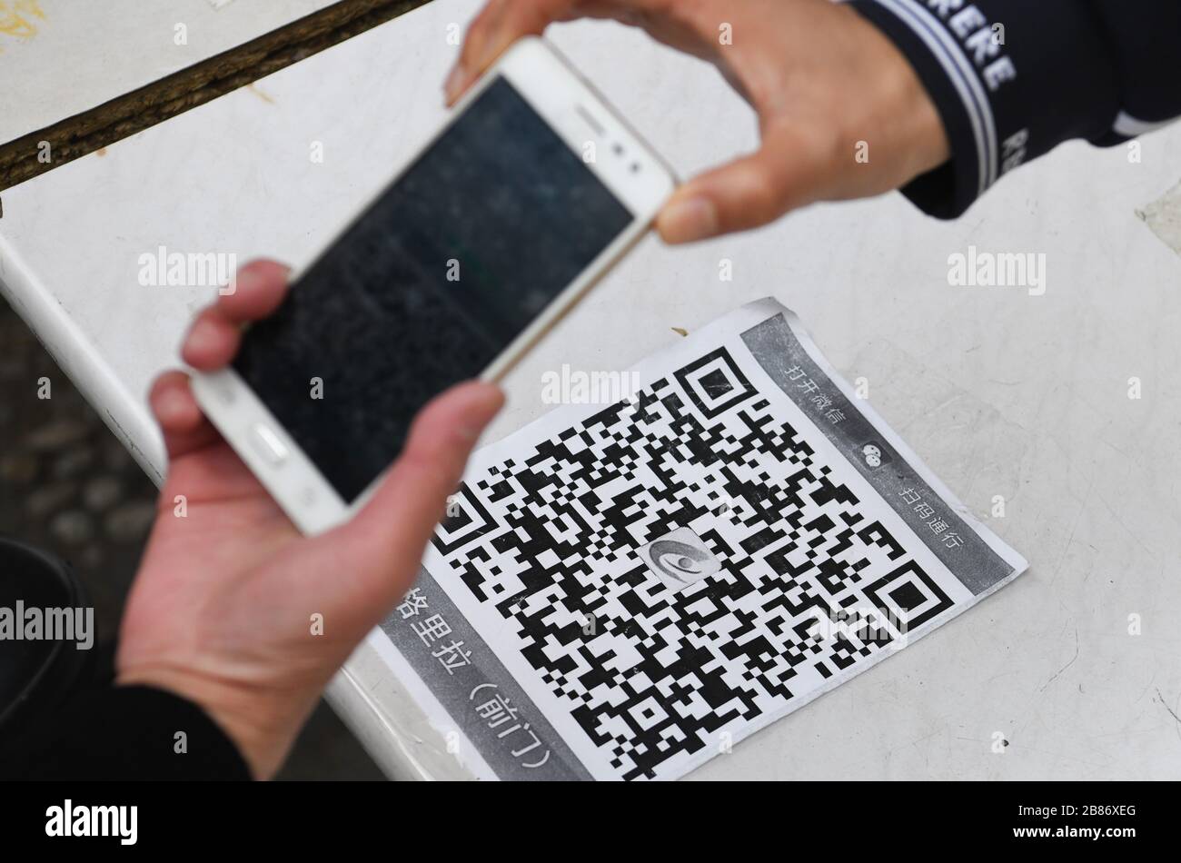 Yichang, China's Hubei Province. 20th Mar, 2020. A resident gets health ...