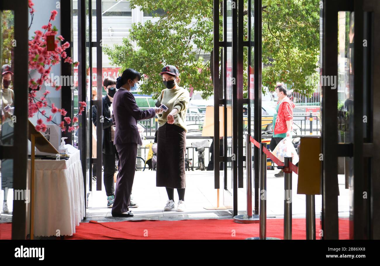 Yichang, China's Hubei Province. 20th Mar, 2020. Staff members check ...