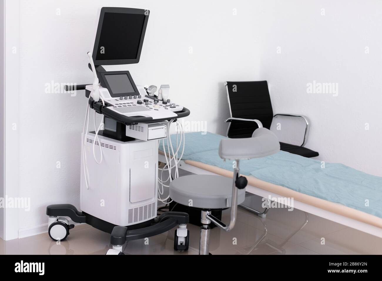ultrasound machine doctor's hand usg investigation Stock Photo - Alamy
