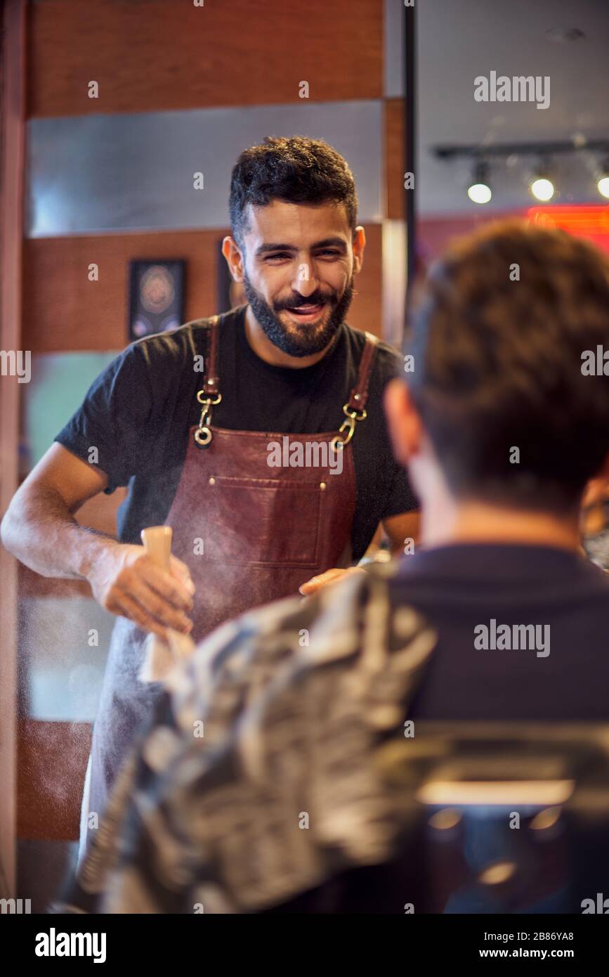 Shaving process of beards in Barbershop. Master makes the client shave ...