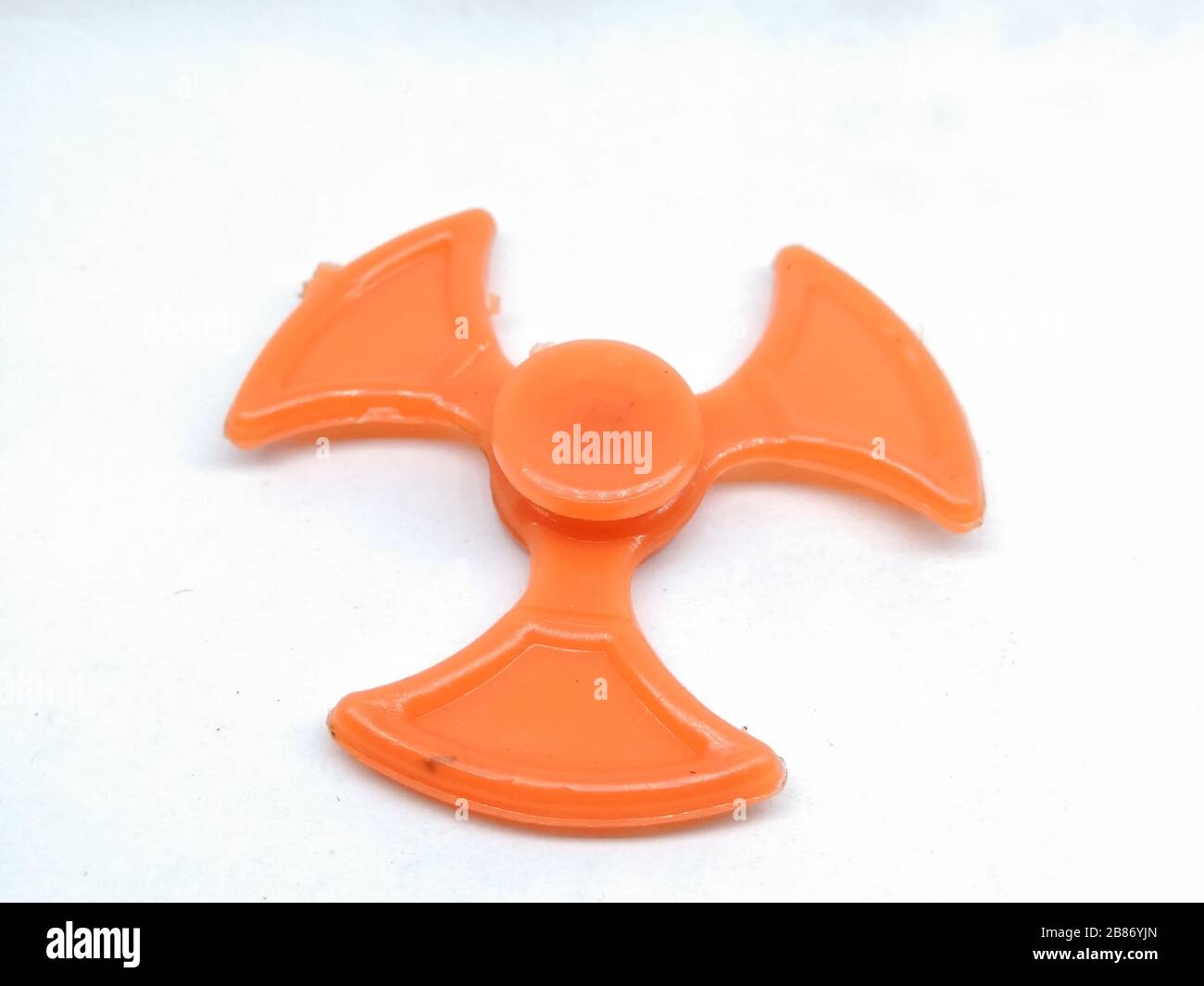 A picture of plastic spinner on white background Stock Photo - Alamy