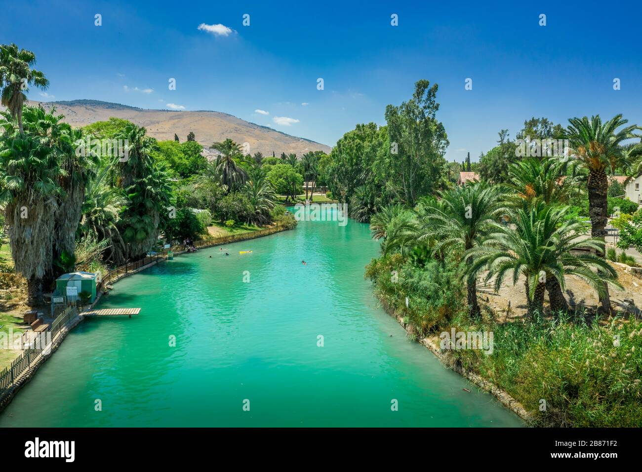 Turquoise water of the river running through Nir David Kibbutz in ...