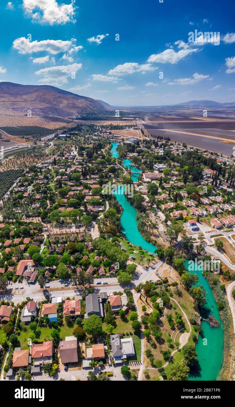 Aerial panorama of turquoise Amal river running through the ...