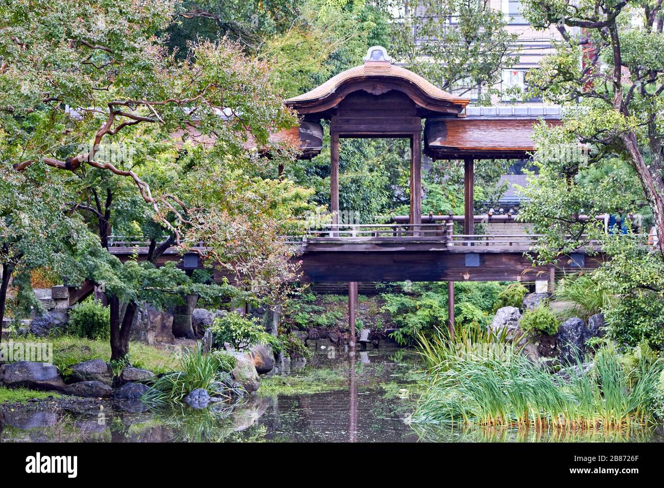 Passage with roof in japanese garden Stock Photo - Alamy