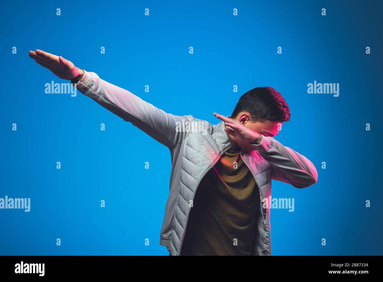 Winner's gesture, dab, dabbing. Caucasian man's portrait isolated on ...