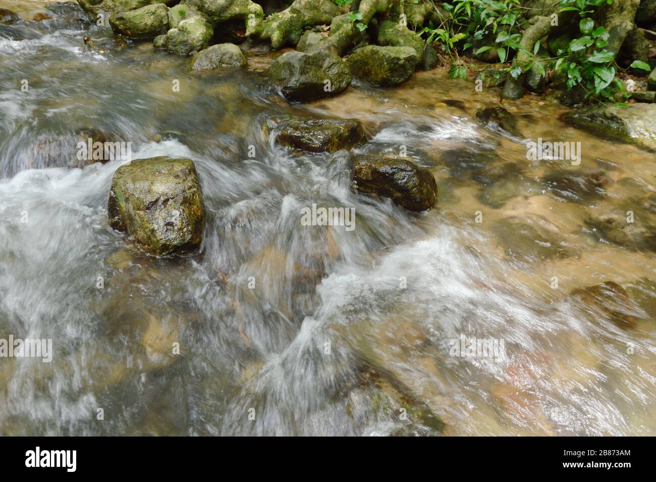 river flowing on cataract and water splashing Stock Photo - Alamy