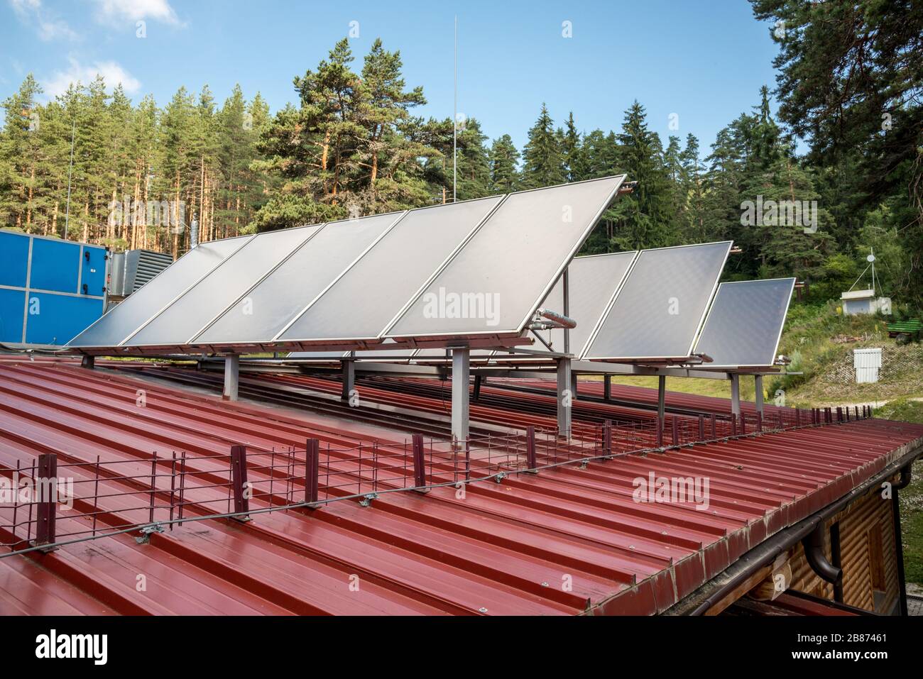 Solar panel on a red roof Stock Photo - Alamy