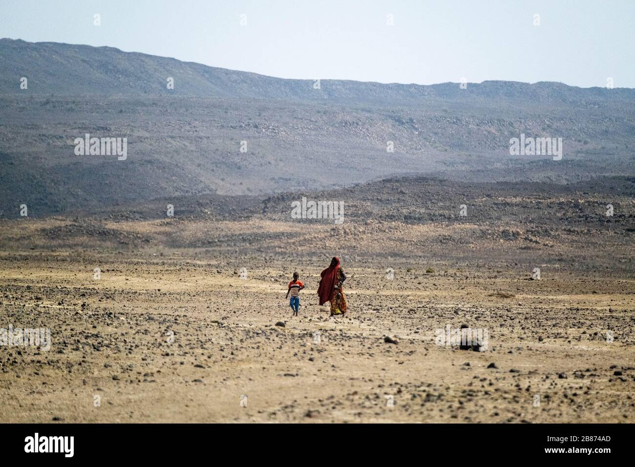 Africa, Djibouti, Lake Abbe. Landscape view of lake Abbe A mother and ...