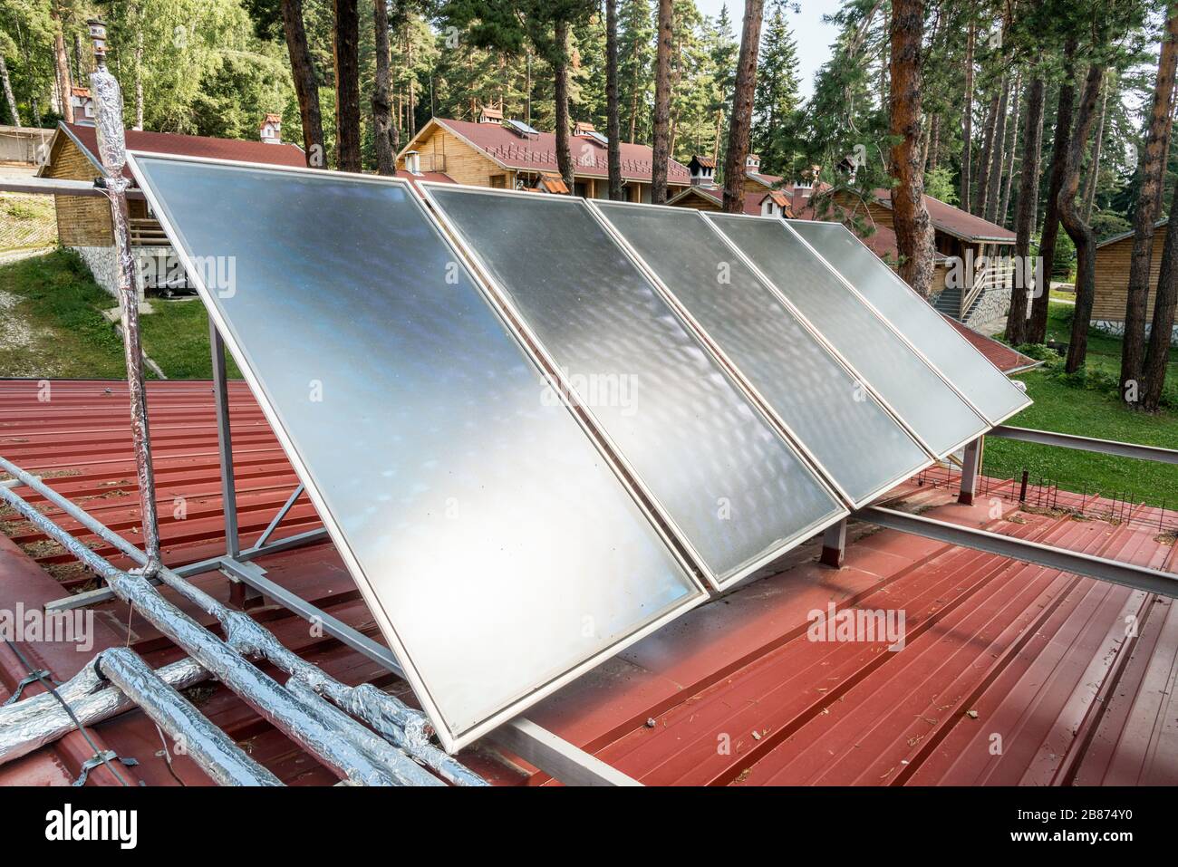 Solar panel on a red roof Stock Photo - Alamy