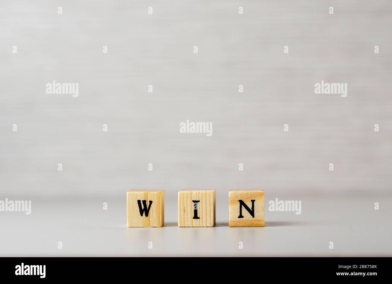 the word win made of letters on wooden cubes 2 Stock Photo - Alamy