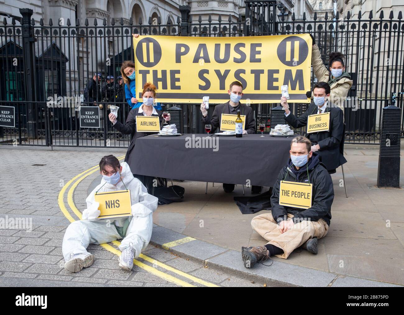 Members of the 'Pause the System' group gather at the gates of Downing ...