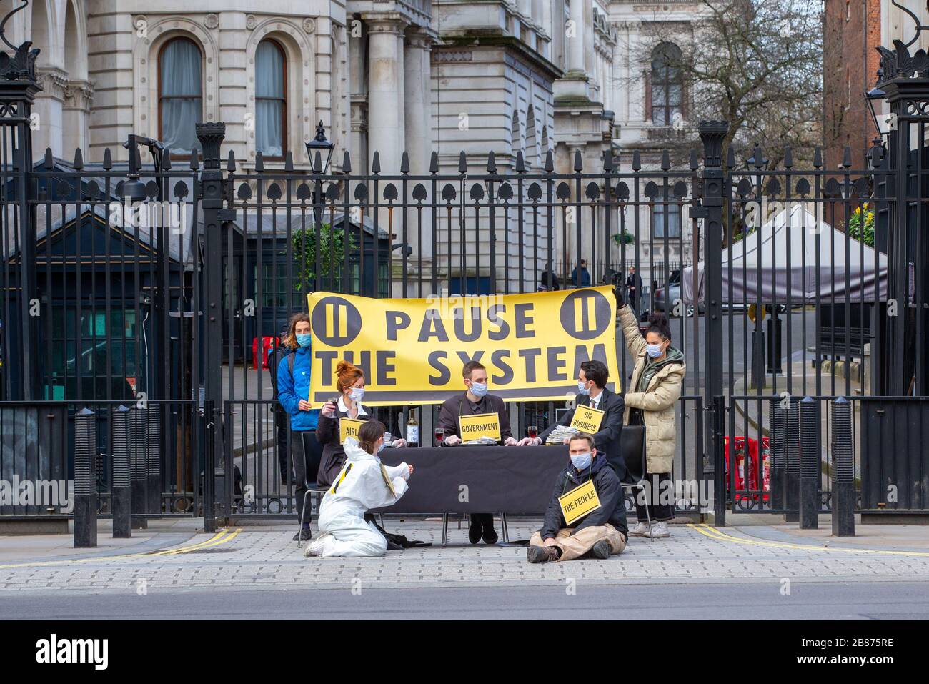 Members of the 'Pause the System' group gather at the gates of Downing ...