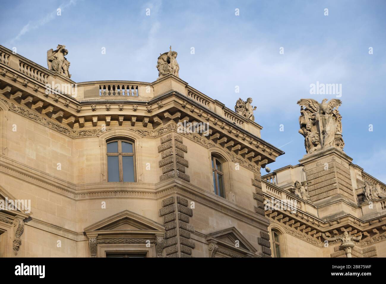 Statues on Roof of Louvre Stock Photo - Alamy