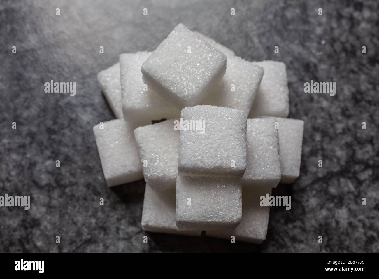 Sugar cubes stacked in a pile Stock Photo - Alamy