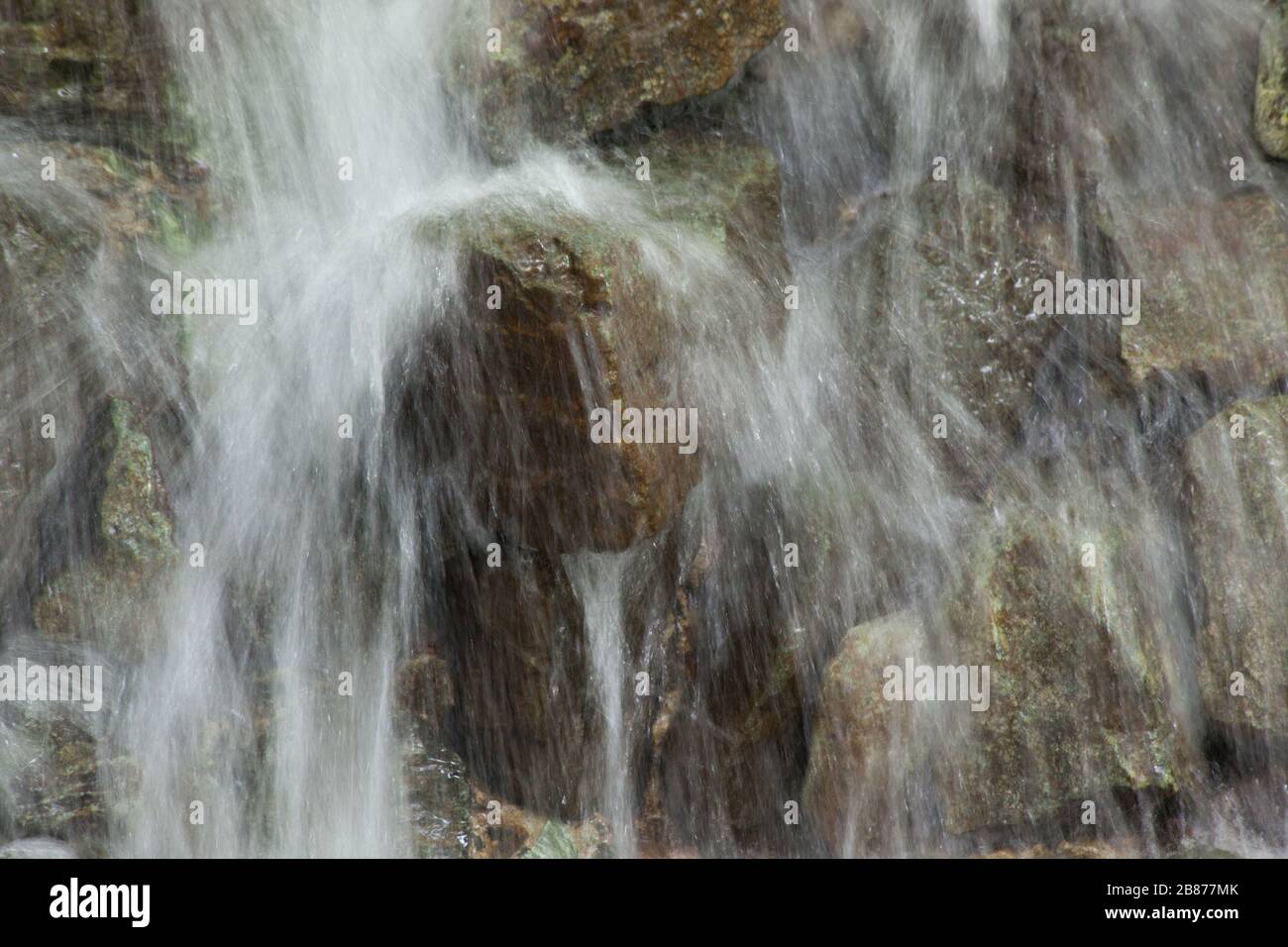 Water falling over rocks Stock Photo - Alamy