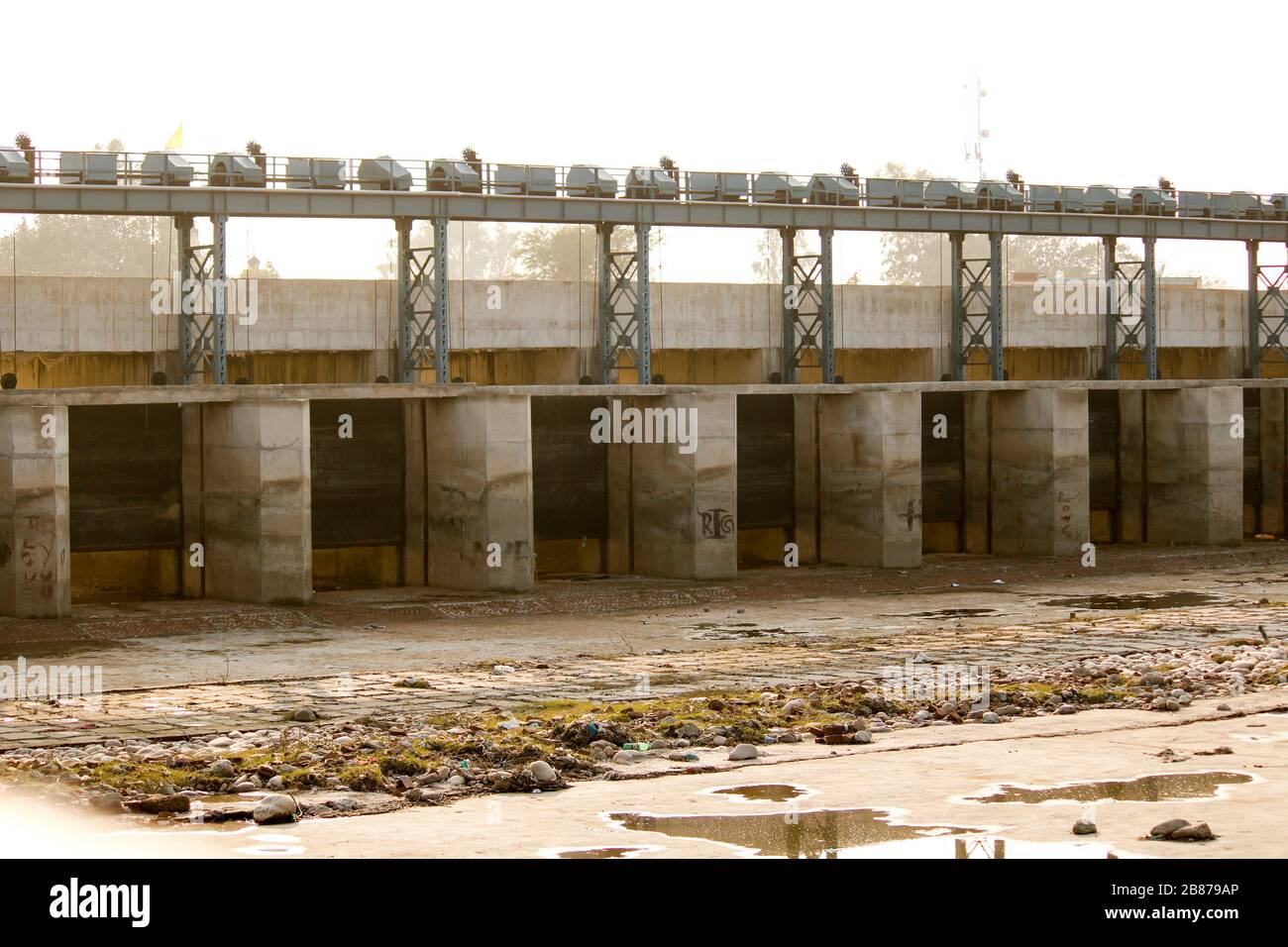 Closed dam of a lake without water Stock Photo - Alamy