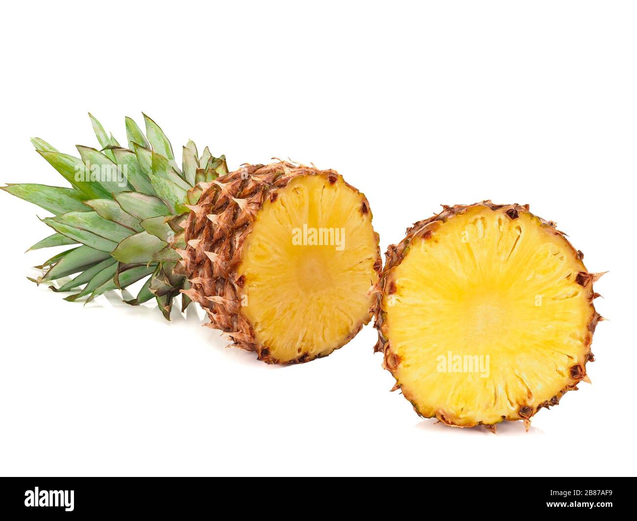 Two halves of pineapple isolated on white background Stock Photo - Alamy