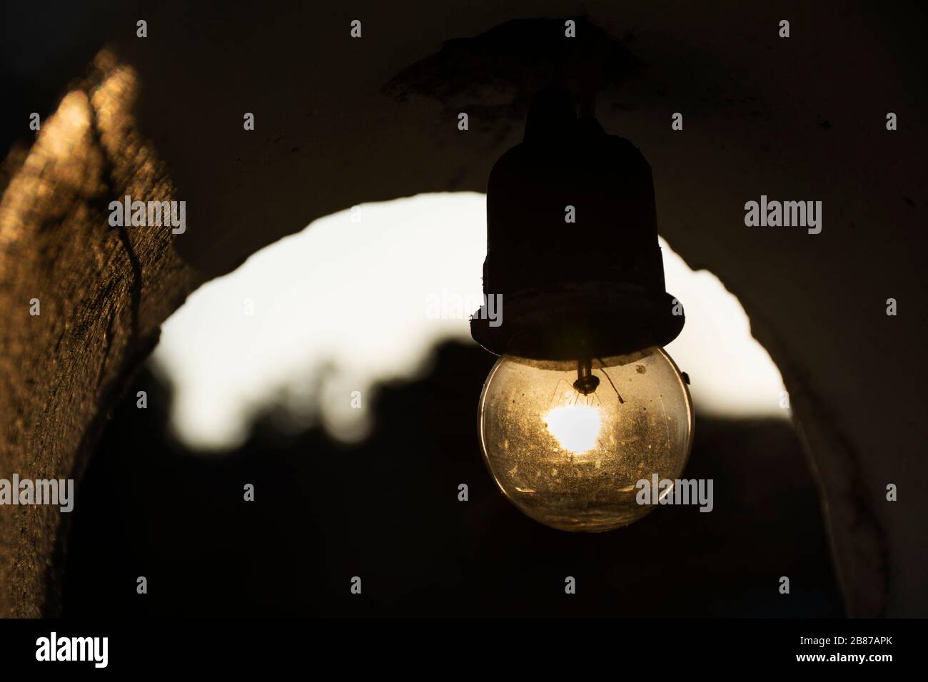 Hanging broken light bulb in hi-res stock photography and images - Alamy