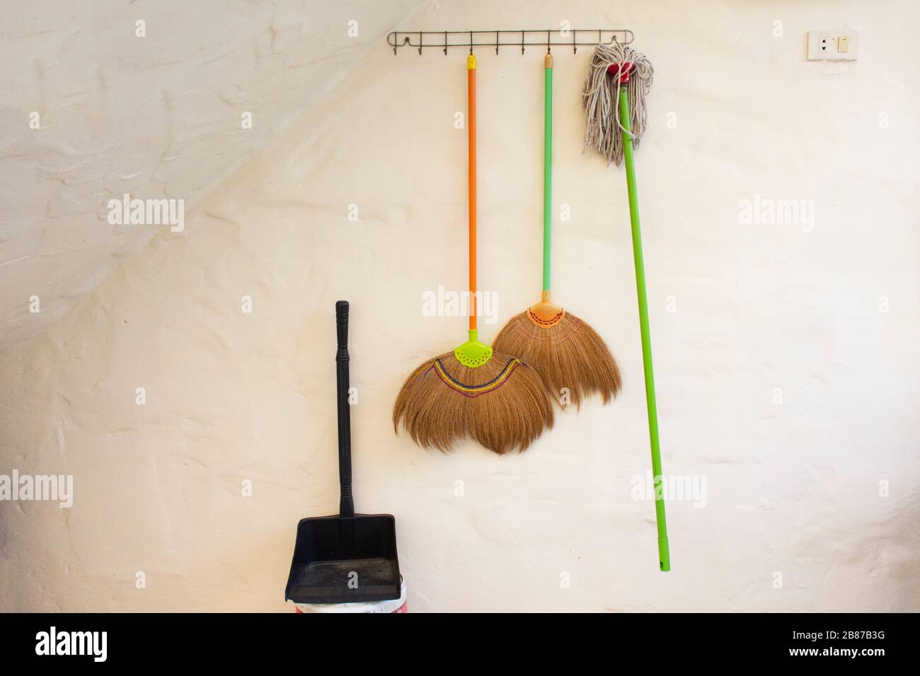 Cleaning equipment hanging at wall for waiting people use at resort of ...