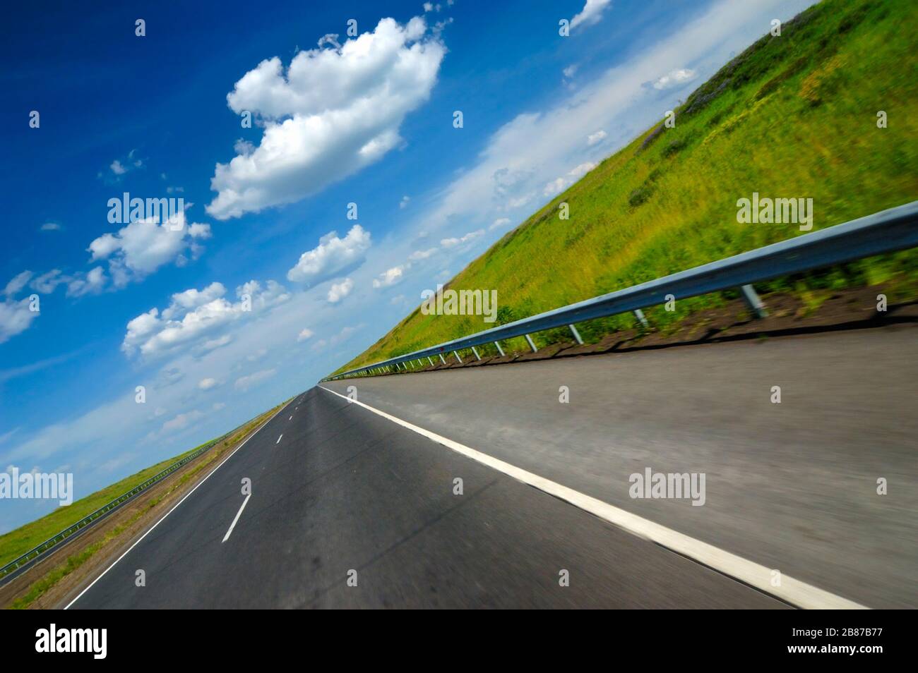 Driving on country road surrounded hi-res stock photography and images ...