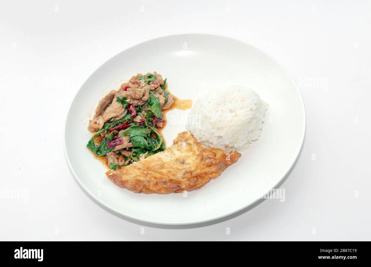 popular Thai food menu with spicy basil fried with pork and serve with ...