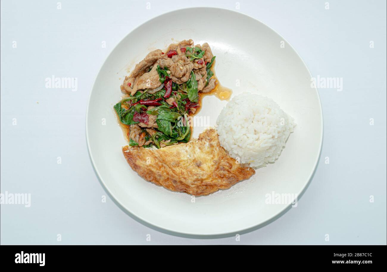 popular Thai food menu with spicy basil fried with pork and serve with ...