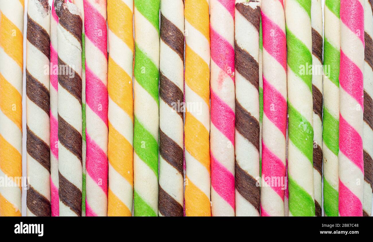 crispy rainbow snack roll with mix flavour on white background Stock ...