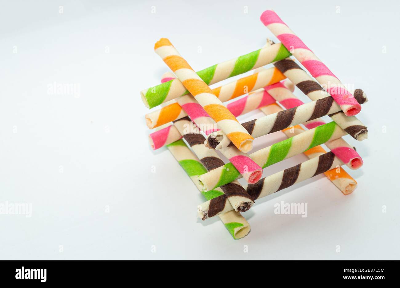 crispy rainbow snack roll with mix flavour on white background Stock ...