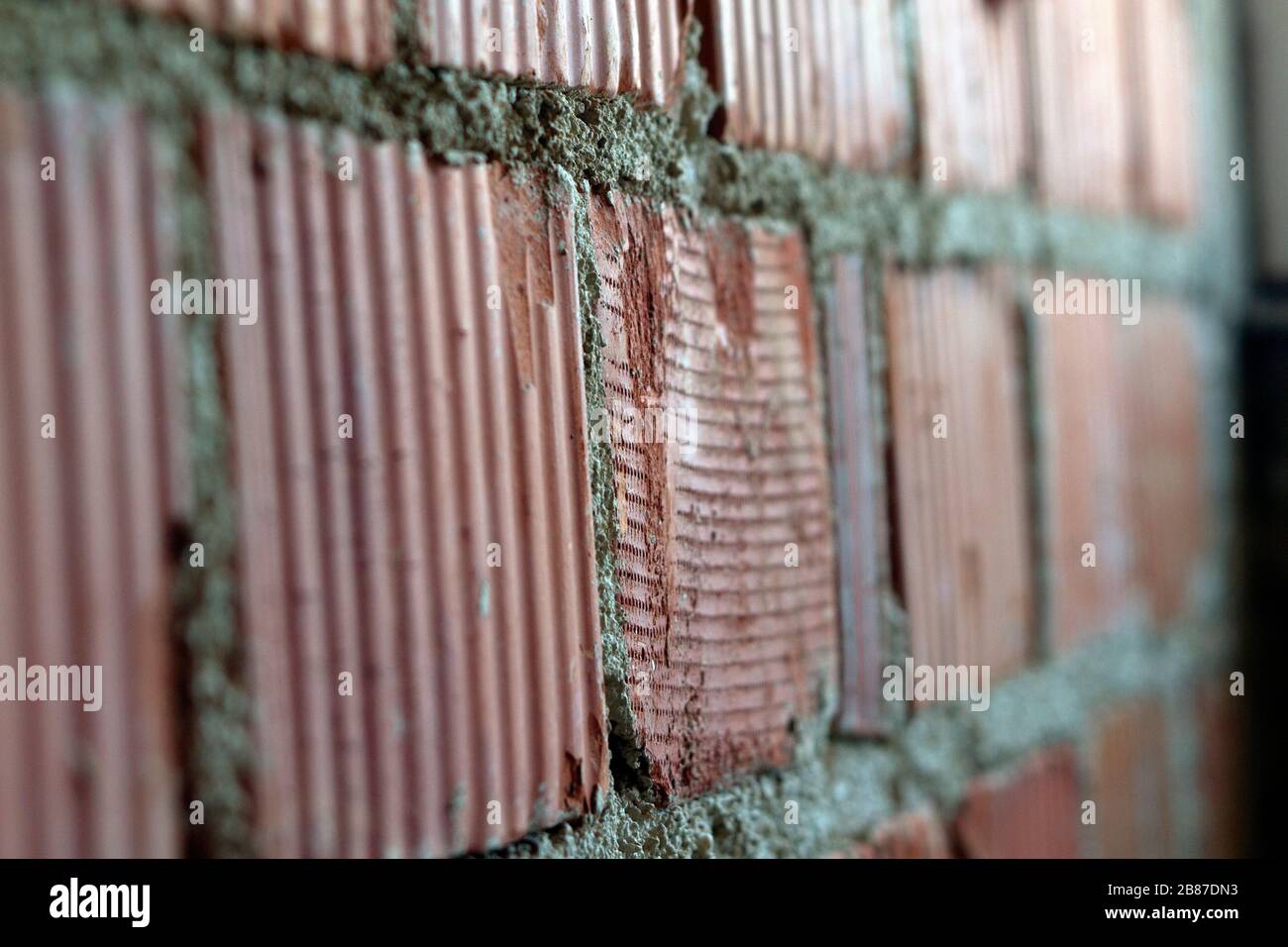 Red brick wall background shallow DOF Stock Photo - Alamy