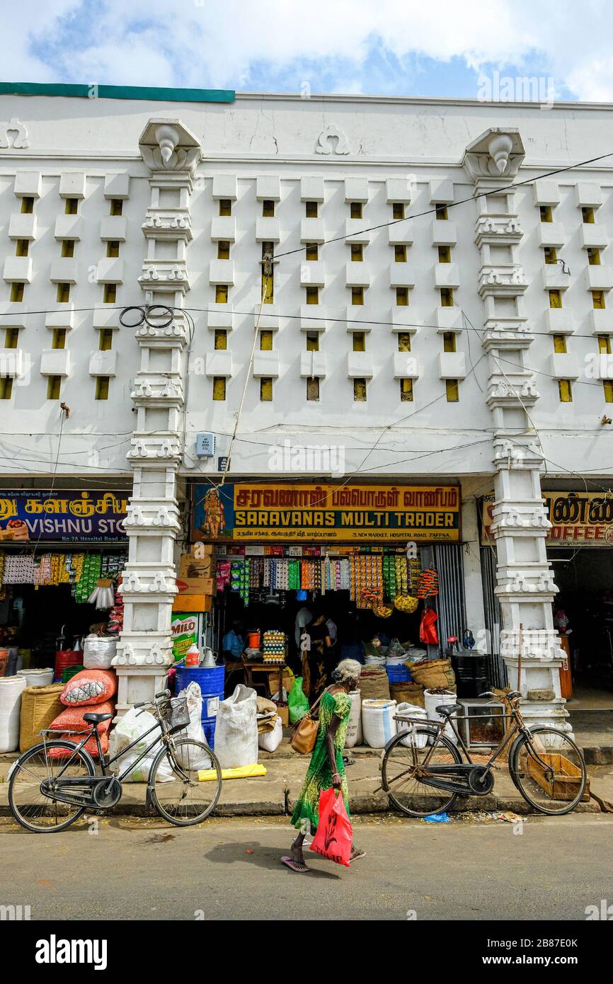 Jaffna, Sri Lanka - February 2020: A woman passing in front of the ...