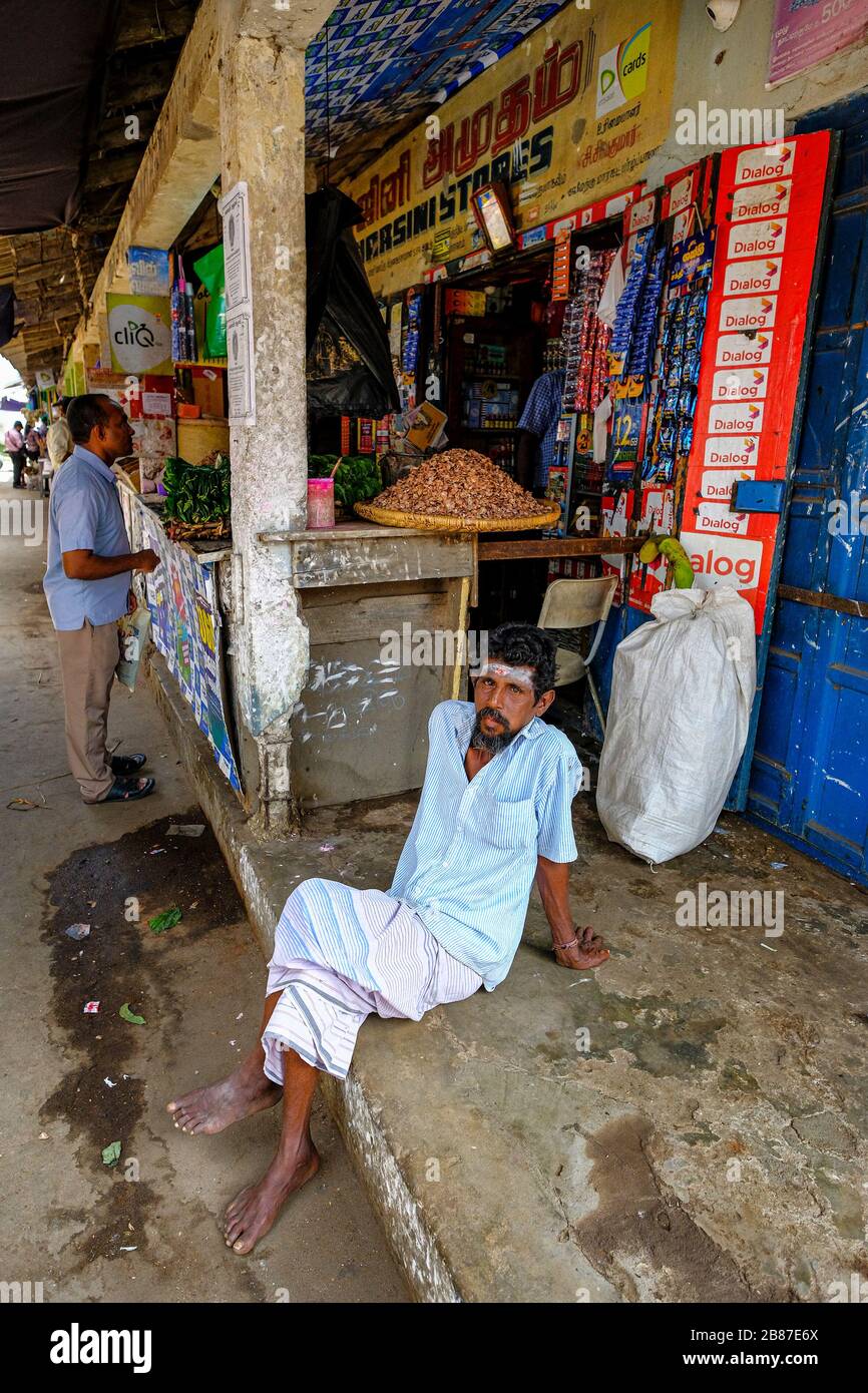 Jaffna, Sri Lanka - February 2020: A man resting at the Jaffna market ...