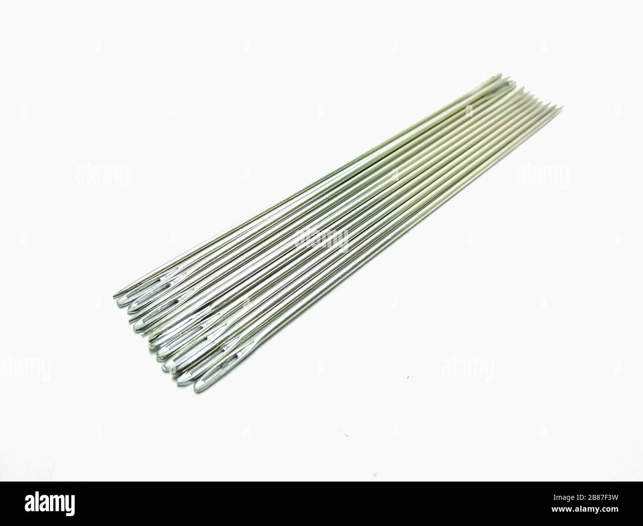 A picture of big needles isolated on white background Stock Photo - Alamy