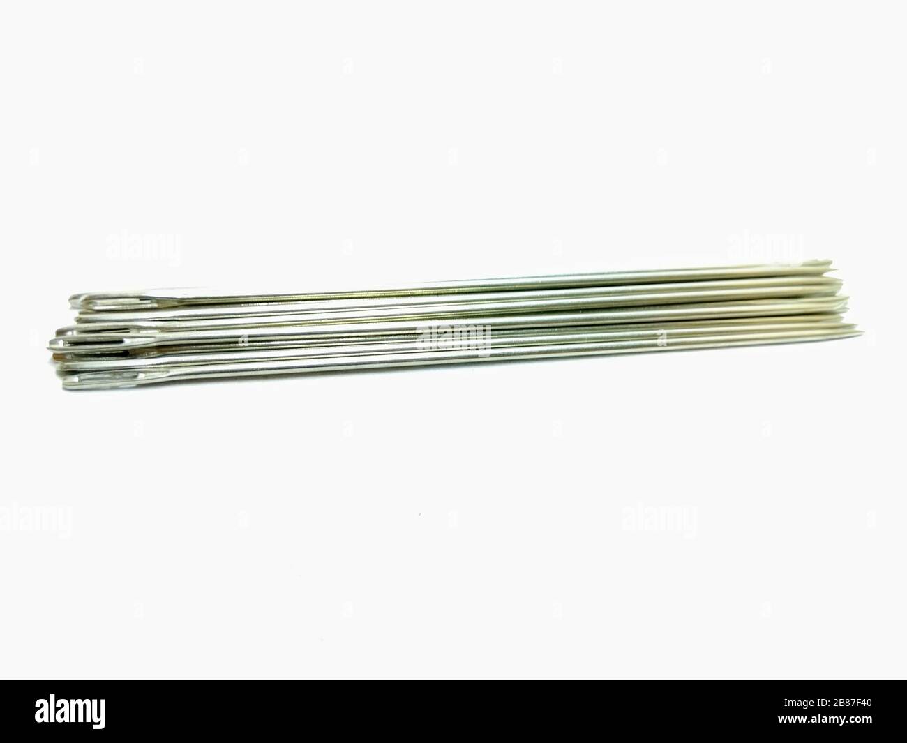 A picture of big needles isolated on white background Stock Photo - Alamy